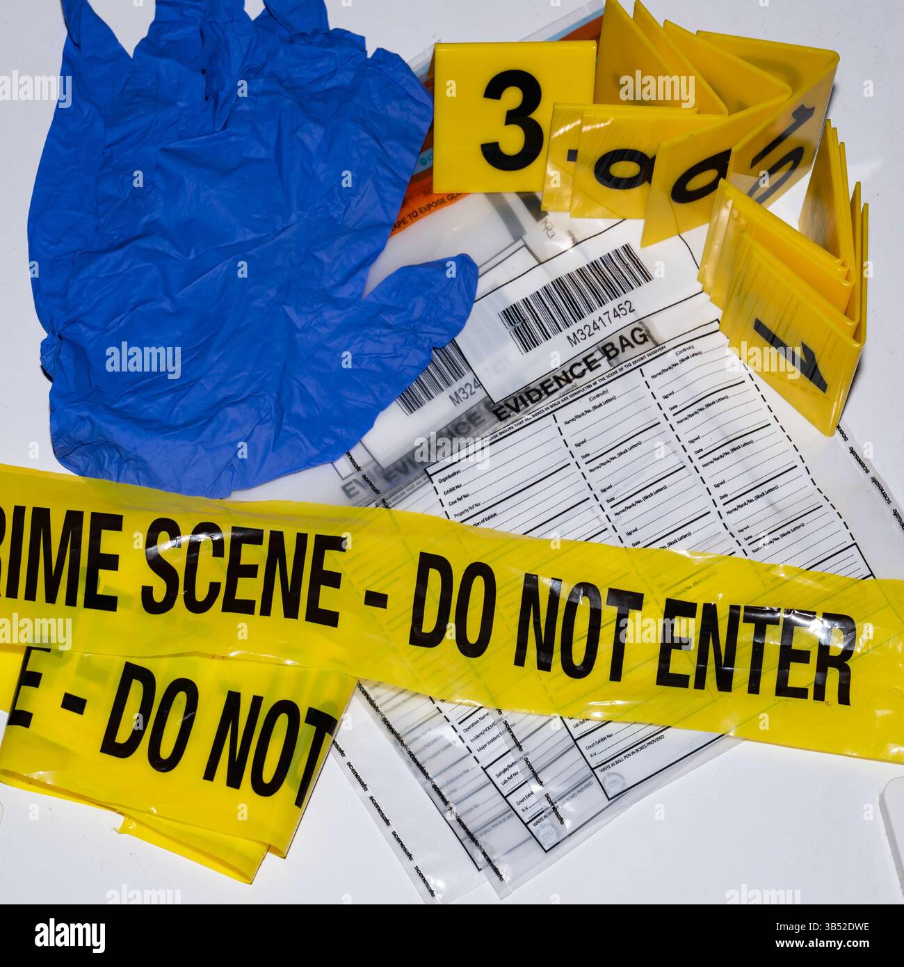 Forensic Scene Tape, Gloves, and Evidence Bag Stock Photo - Alamy