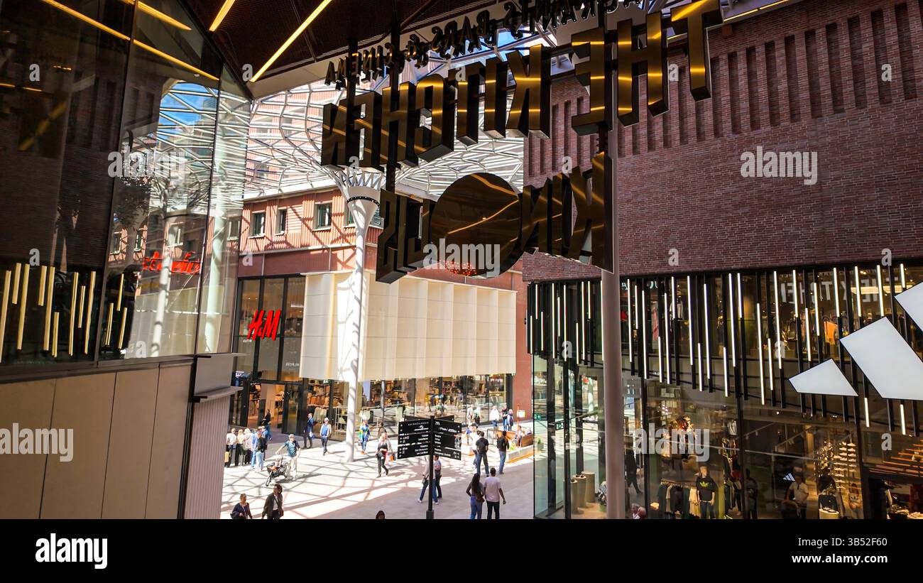HAMBURG, GERMANY - APRIL 29, 2025 - Modern shopping center with people ...