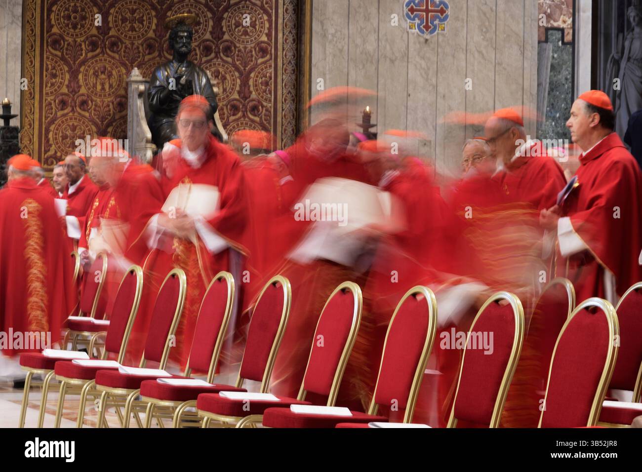 Cardinals wait for the start of a mass on the sixth of nine days of ...