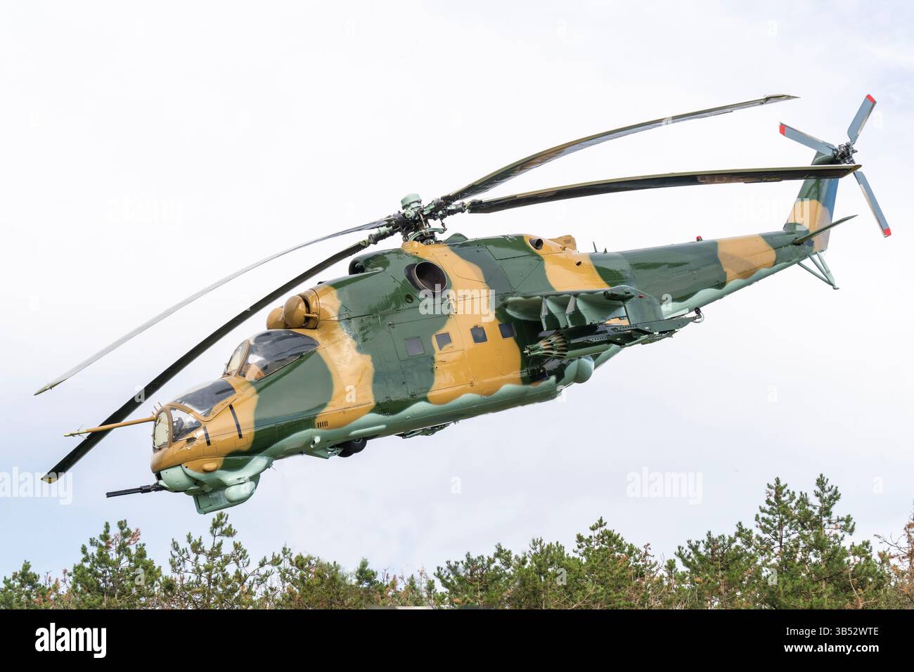 Camouflaged Mi-24 Soviet military attack helicopter in low flight Stock ...