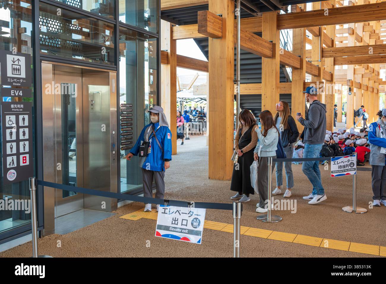 Osaka, Japan - April 30 2025 : Visitors waiting by the elevator area to ...