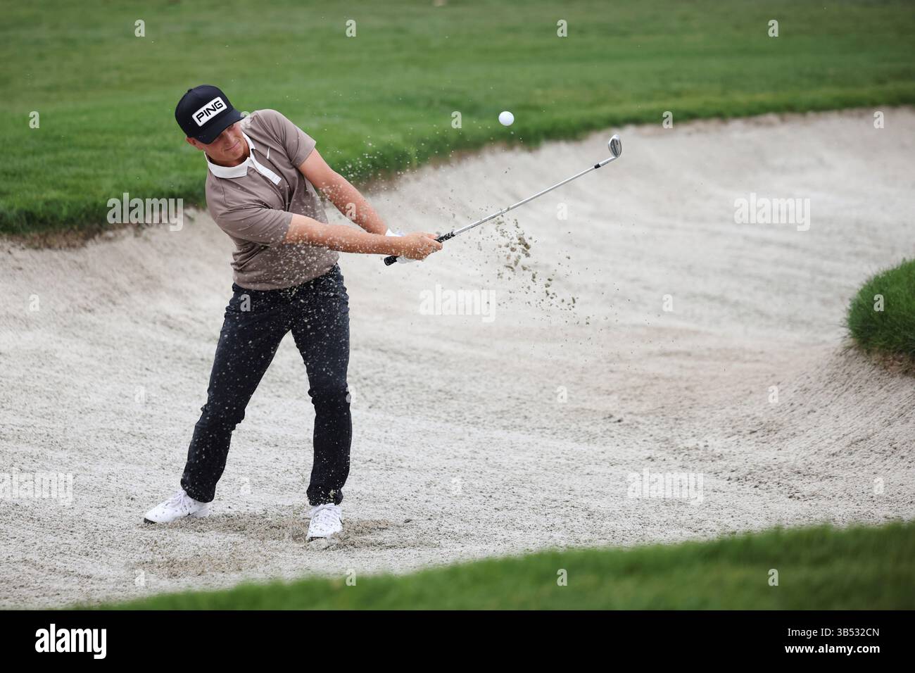 William Mouw chips onto the 18th green during the first round of the CJ ...