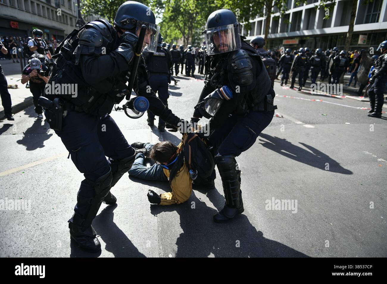 Riot police arrests a protester during the annual Labour Day rally on ...