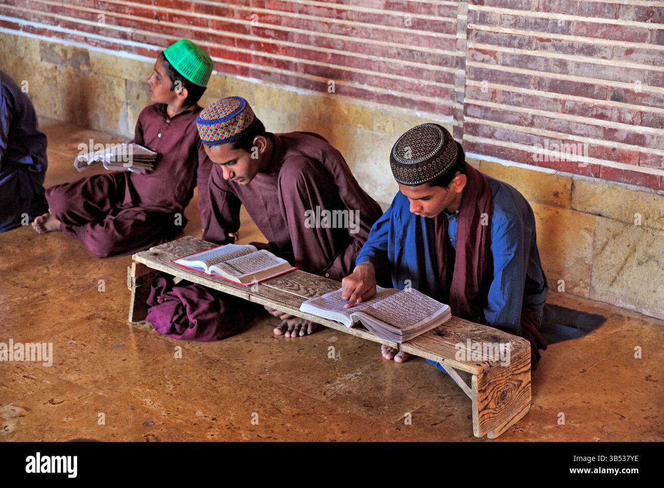 Religious students study Muslim's holy book Koran at a madrassa ...