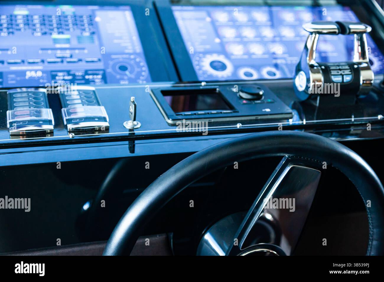 Luxury yacht cockpit with dashboard, steering wheel and acceleration ...