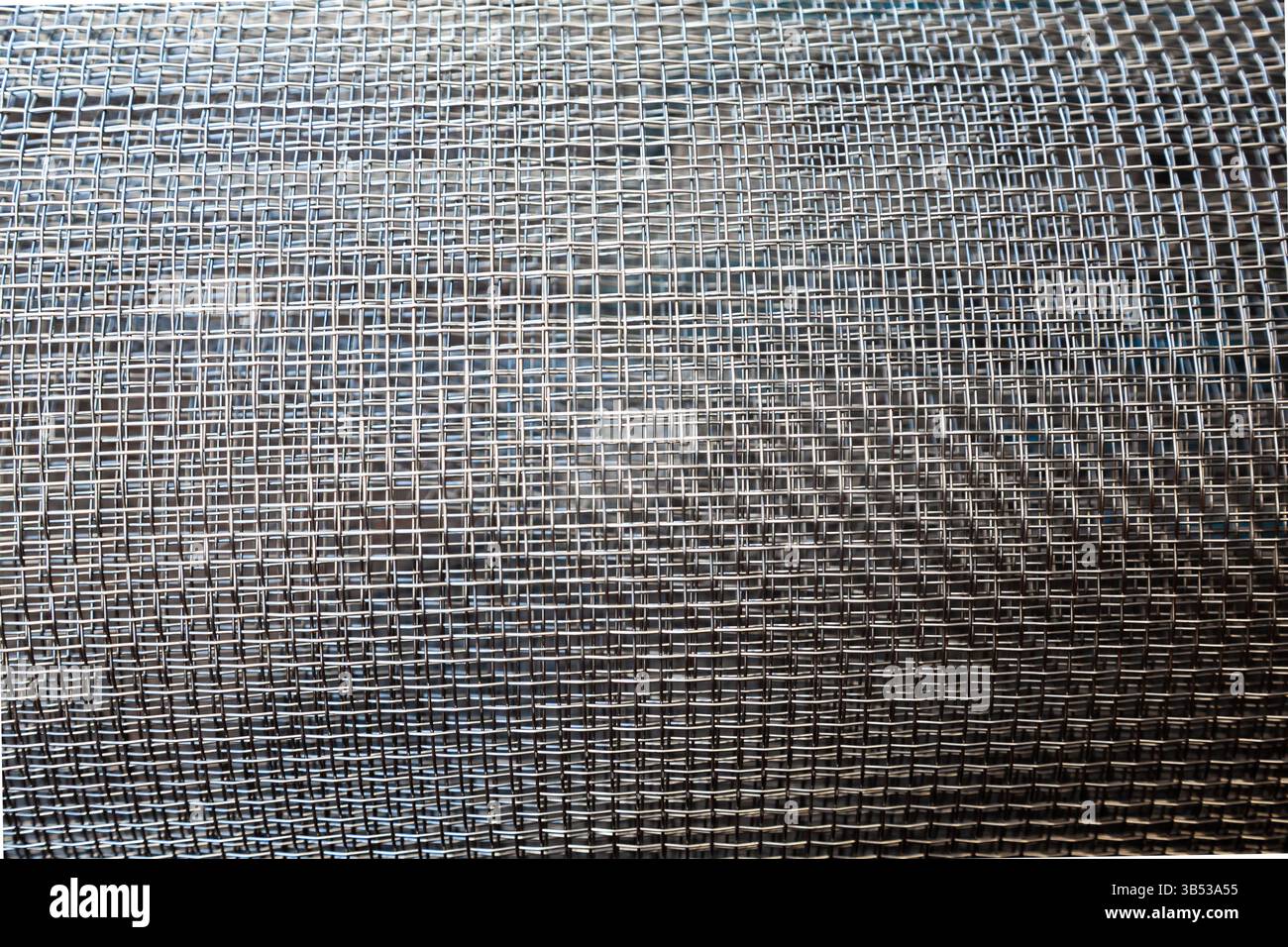Rolled stainless steel mesh with square weaves, close-up Stock Photo ...