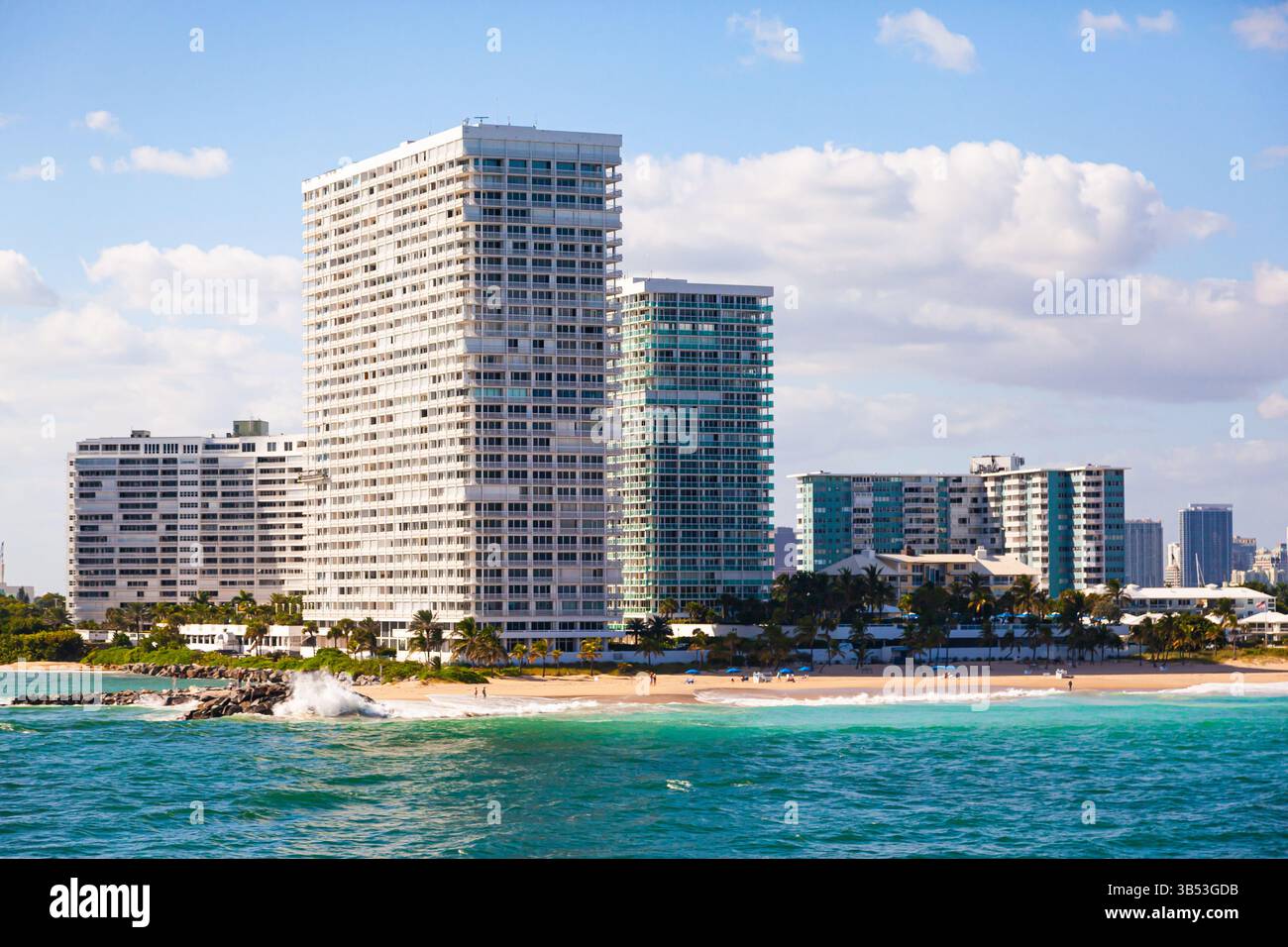 View of residential high-rise buildings with a gorgeous beach on the ...