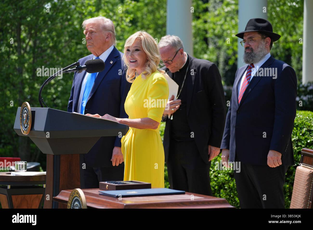 Pastor Paula White speaks as President Donald Trump, left, listens ...