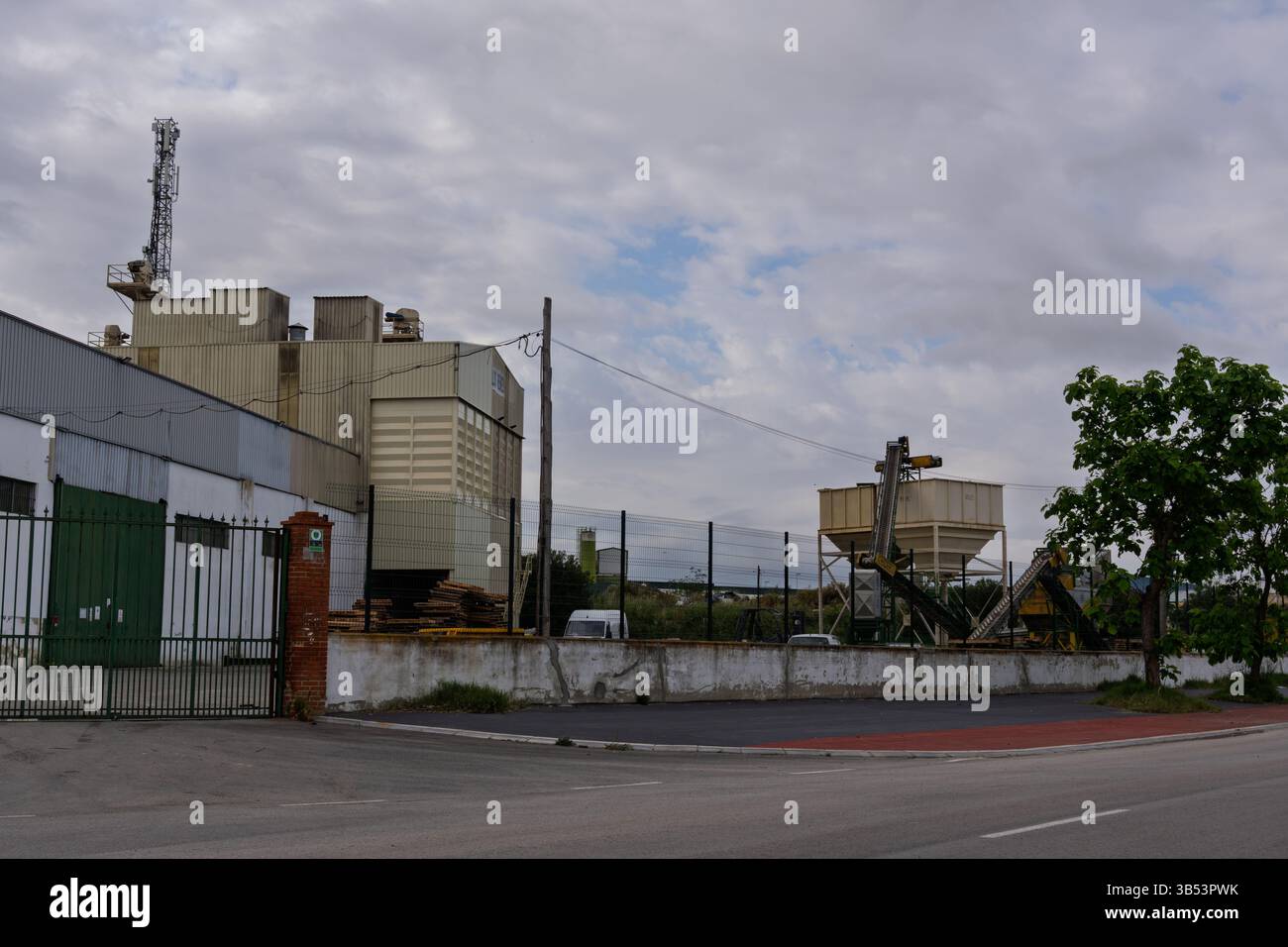 Industrial estate featuring buildings, silos, and equipment used for ...