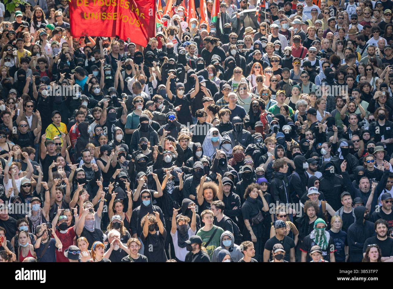 Paris, France. 01st May, 2025. Hooded protesters forming a “black bloc ...