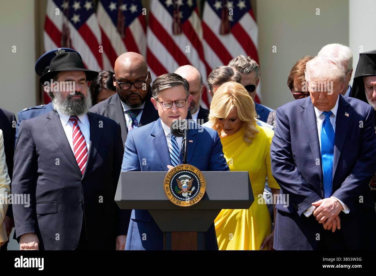 Speaker of the House Mike Johnson prays with from left, Rabbi Levi ...