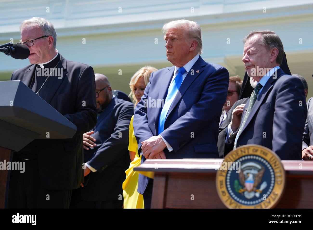 Bishop Robert Barron speaks as President Donald Trump, center, listens ...