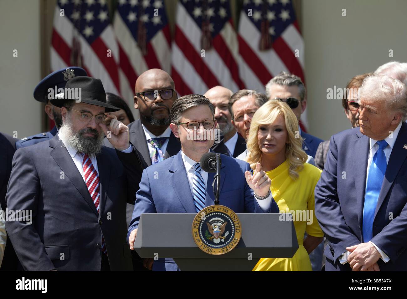 Speaker of the House Mike Johnson speaks with from left, Rabbi Levi ...