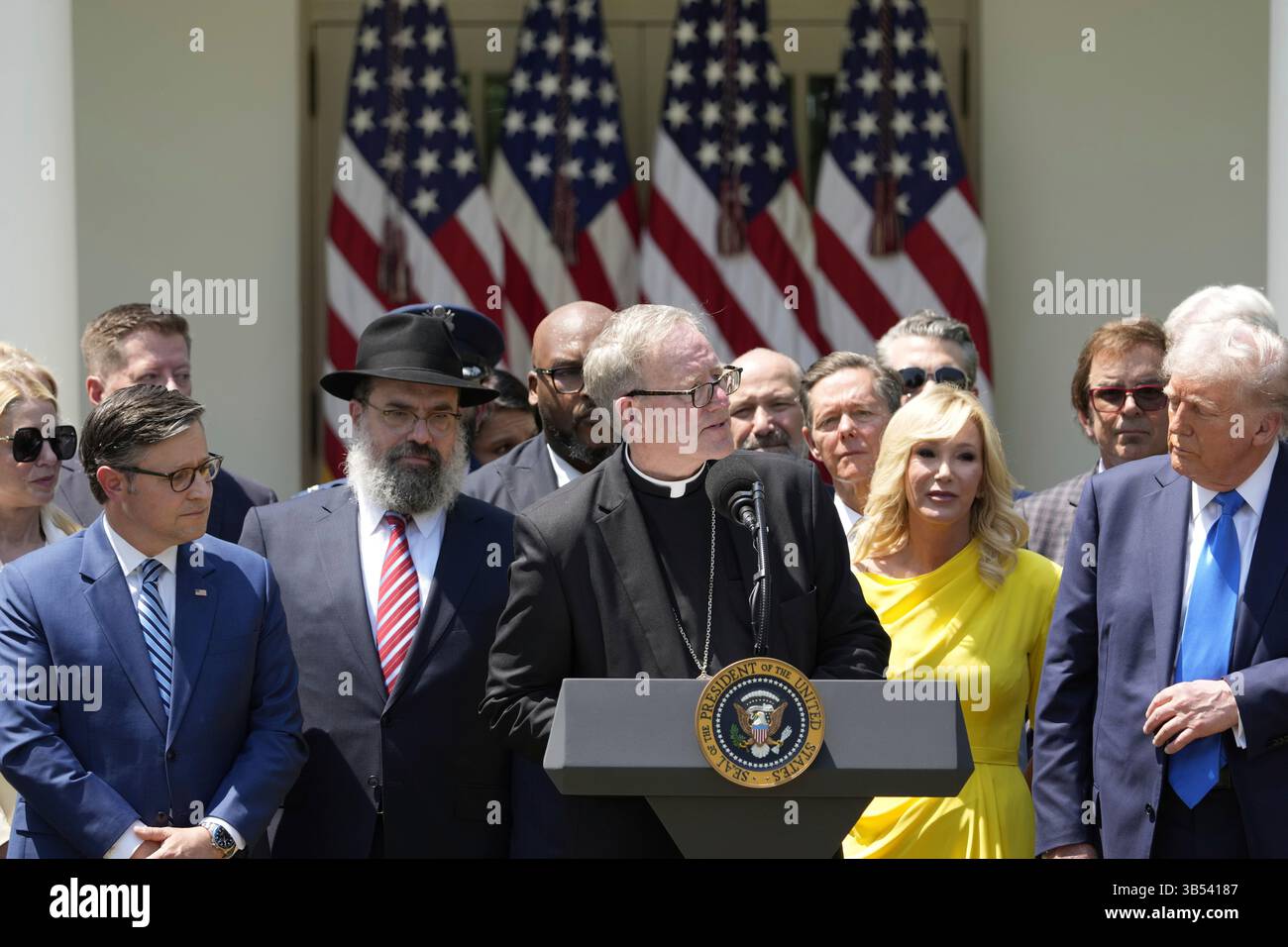 Bishop Robert Barron, with from left front, House Speaker Mike Johnson ...