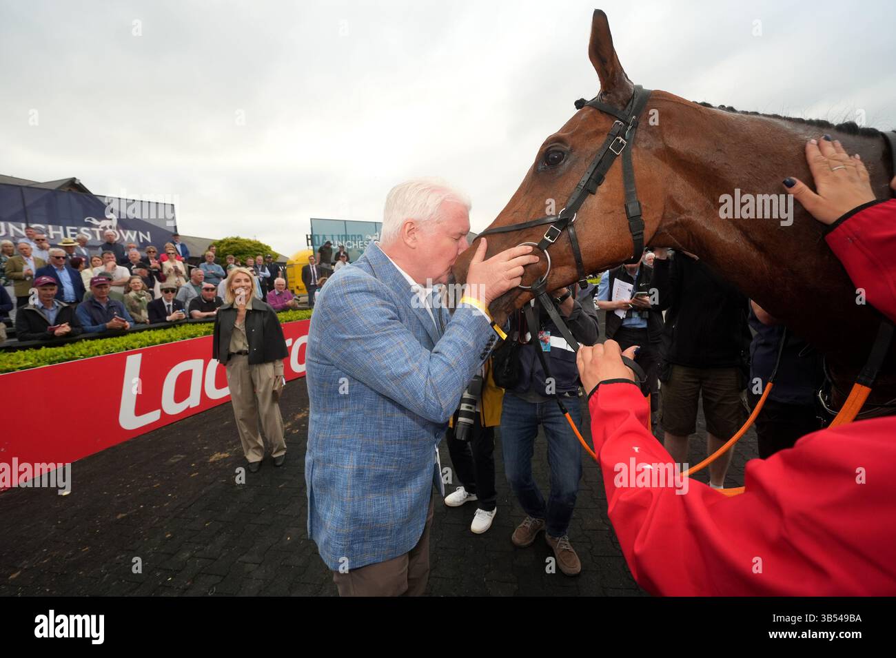 Owner Brian Acheson kisses horse Teahupoo after victory in the ...