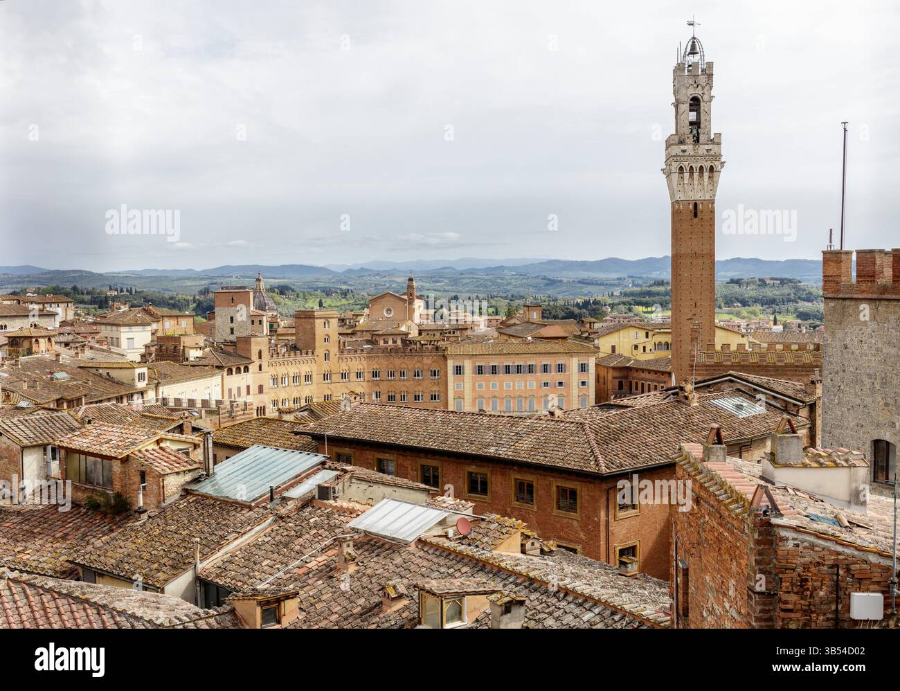 Siena, Tuscany, Italy - April 20, 2025: Overlook on the rooftops of the ...