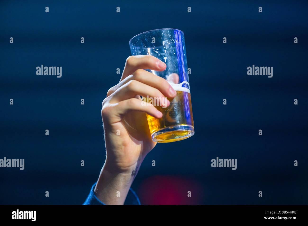 Hand with a glass of beer hi-res stock photography and images - Alamy