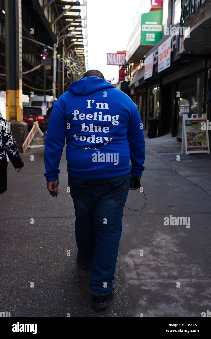 Person wearing blue hoodie hi-res stock photography and images - Alamy