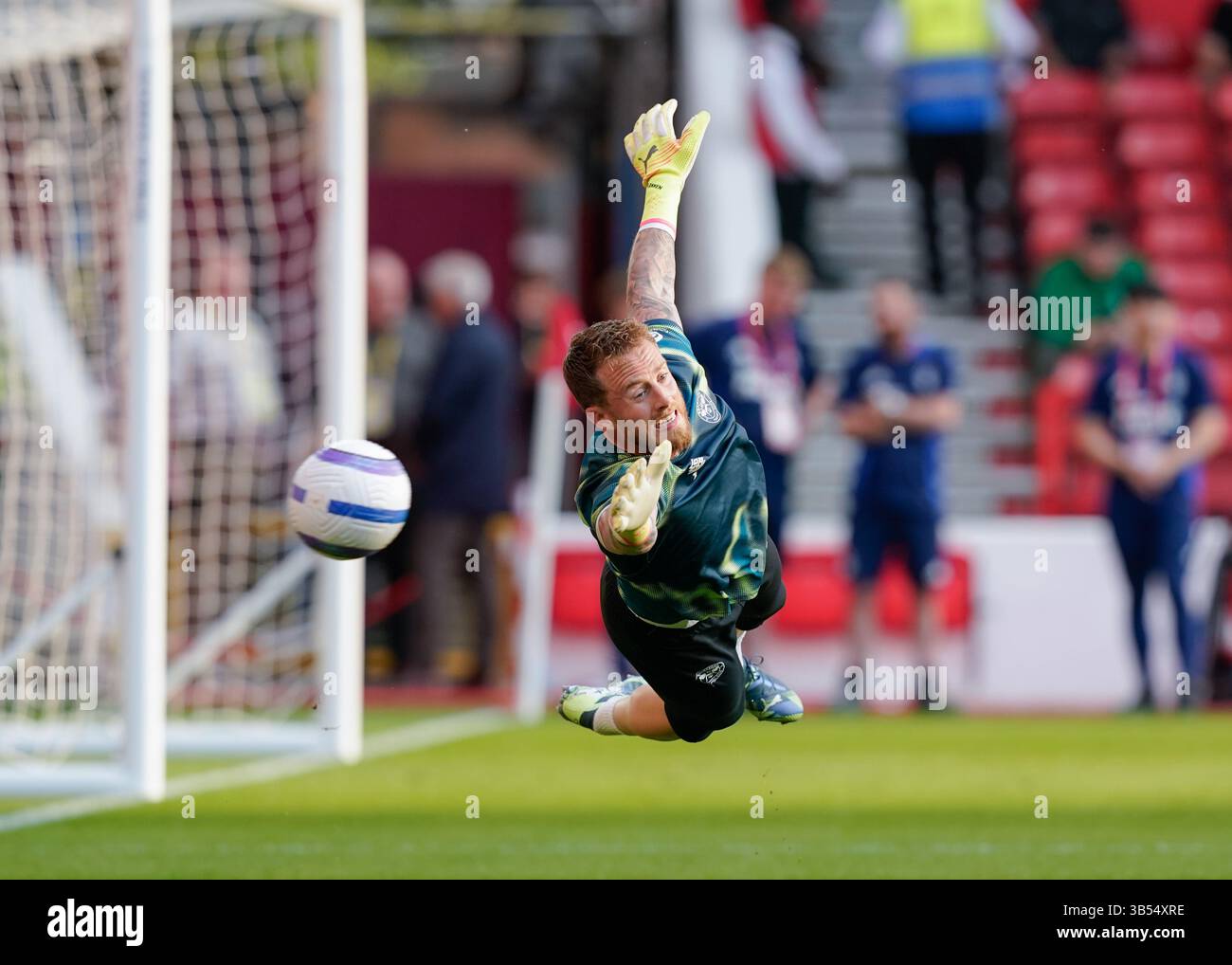 Nottingham, England, 1st May 2025. Mark Flekken of Brentford warms up ...