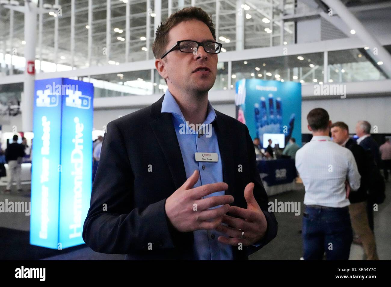Steve Crowe, of the Robotics Summit & Expo, gestures during an ...