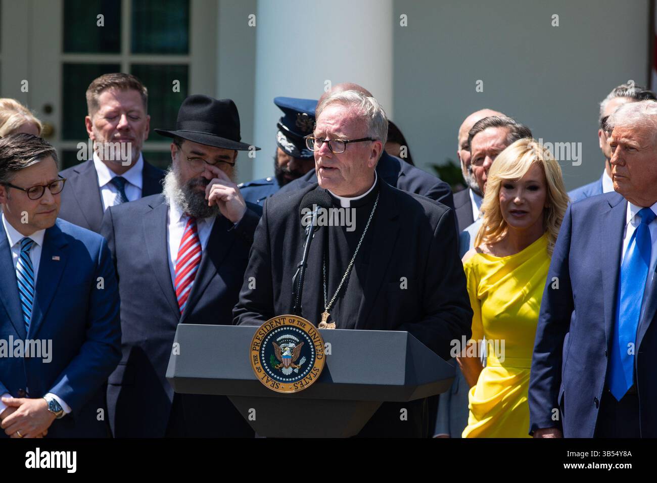 President Donald Trump is joined by Catholic Bishop Robert Barron ...