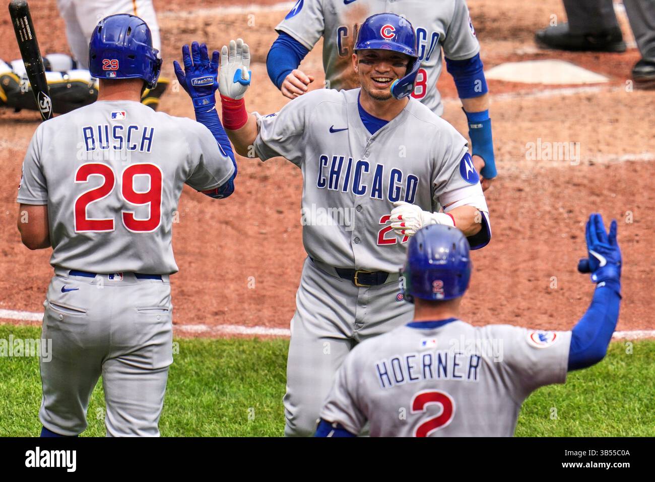 Chicago Cubs' Seiya Suzuki, top right, celebrates with Michael Busch ...