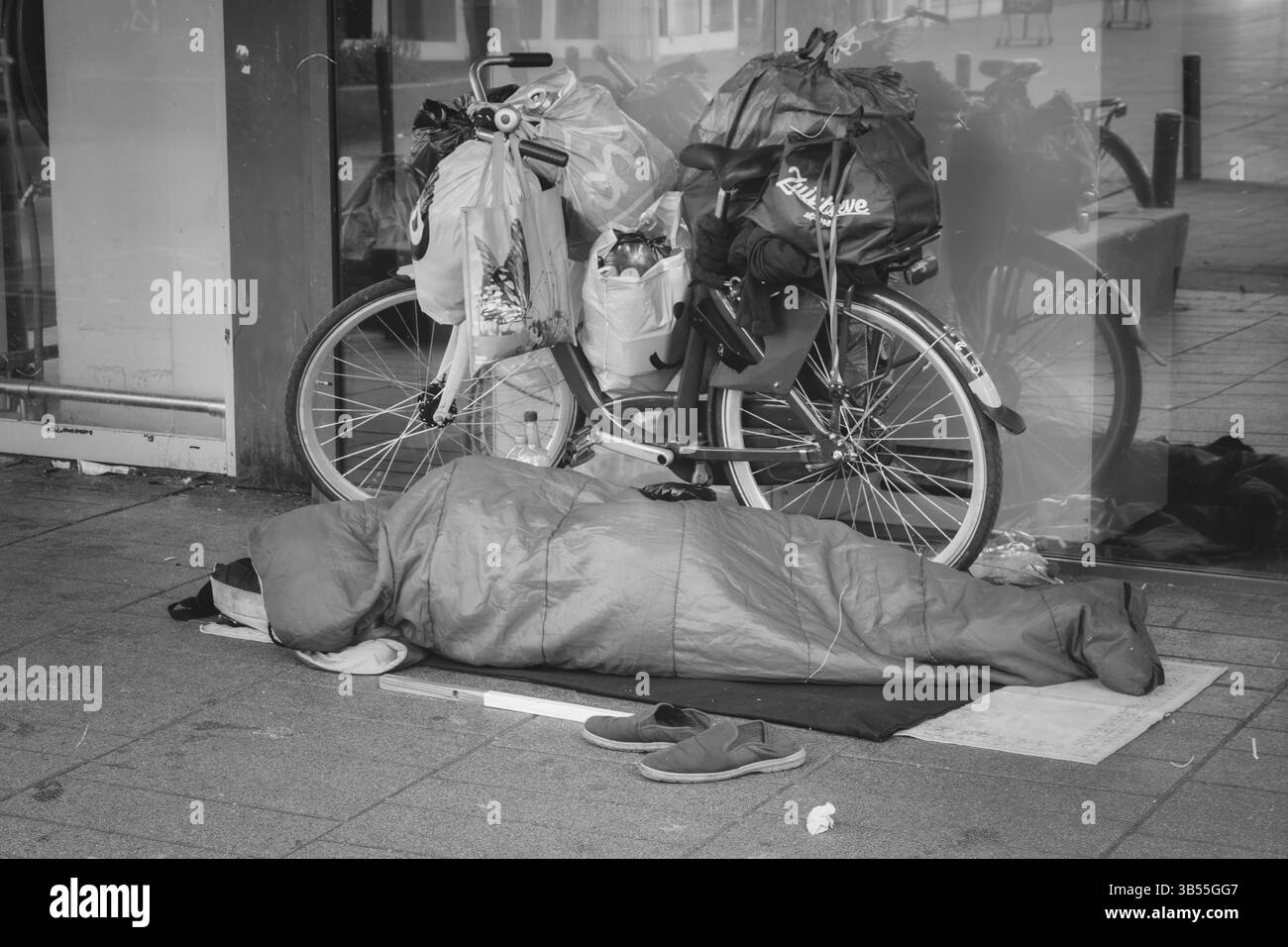 Homeless Man Sleeping In Front Of A AH Supermarket At Amsterdam The ...