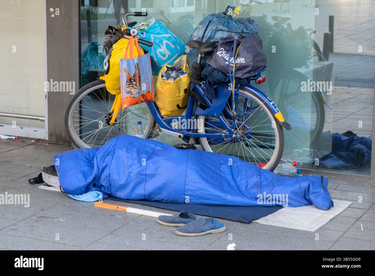 Homeless Man Sleeping In Front Of A AH Supermarket At Amsterdam The ...