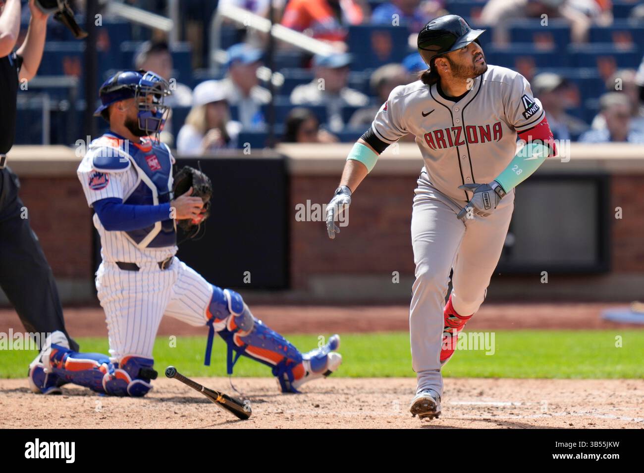 Arizona Diamondbacks' Eugenio Suárez watches his sacrifice fly during ...