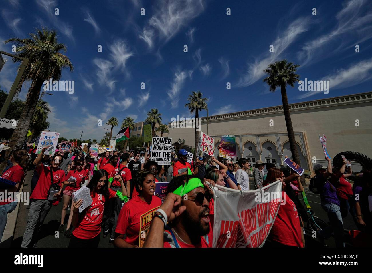 Demonstrators march during a May Day protest at the Capitol, Thursday ...