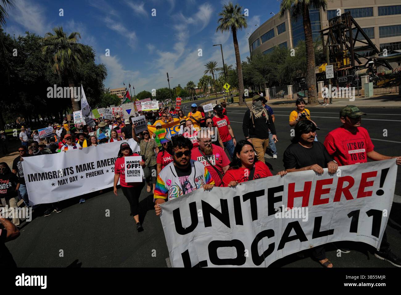 Demonstrators march during a May Day protest at the Capitol, Thursday ...