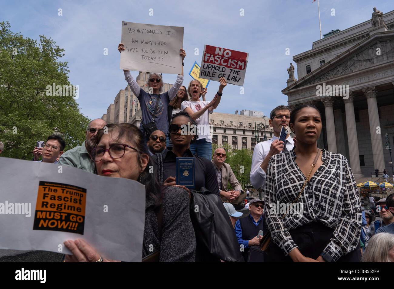 People take part in a May Day rally for the Rule of Law, Thursday, May ...