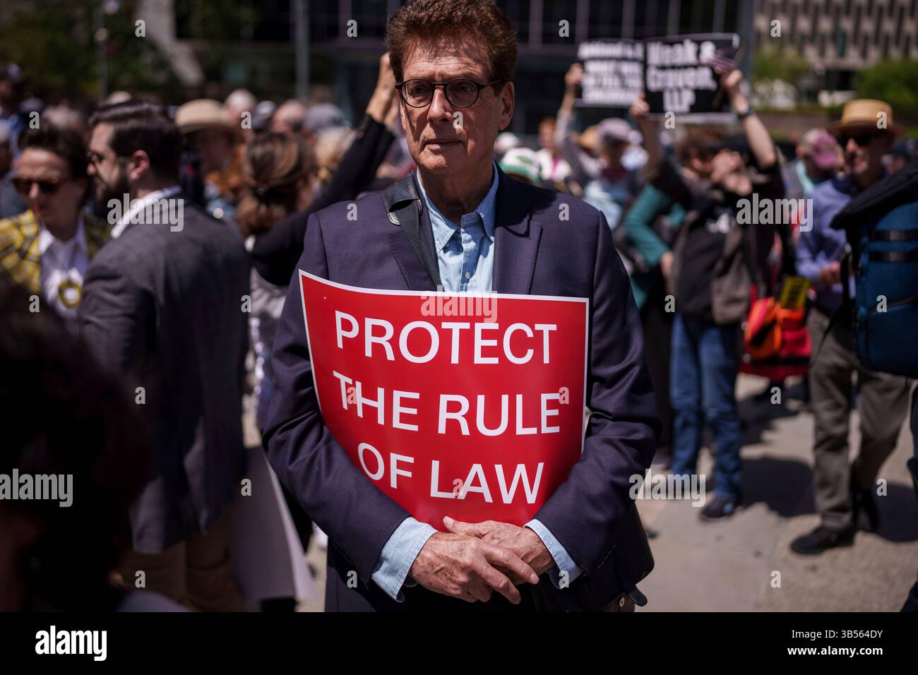 People take part in a May Day rally for the Rule of Law, Thursday, May ...