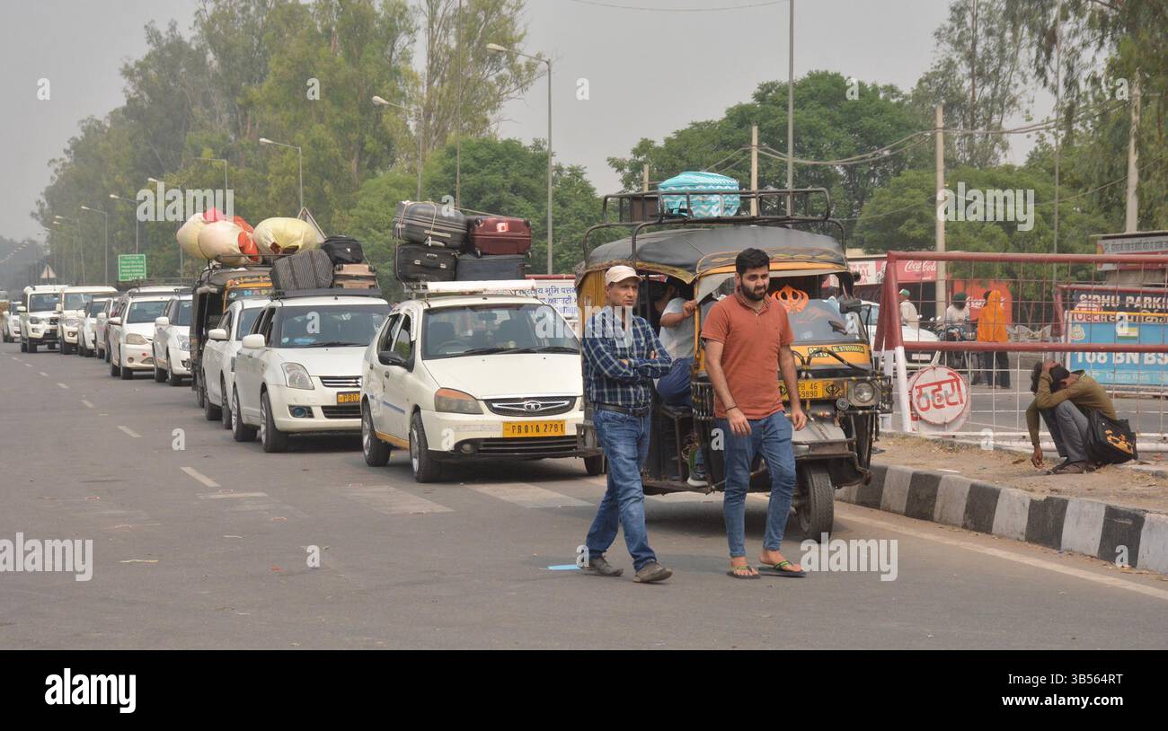 AMRITSAR, INDIA - MAY 1: Long queue of vehicles with luggage and ...