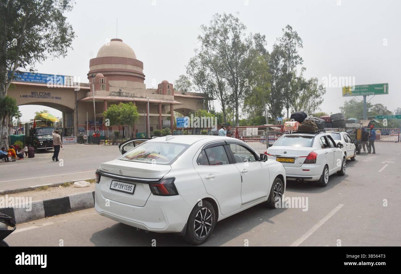 AMRITSAR, INDIA - MAY 1: Long queue of vehicles with luggage and ...