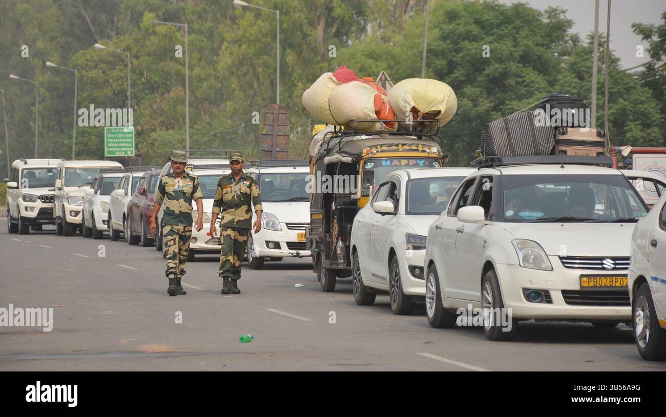 AMRITSAR, INDIA - MAY 1: Long queue of vehicles with luggage and ...