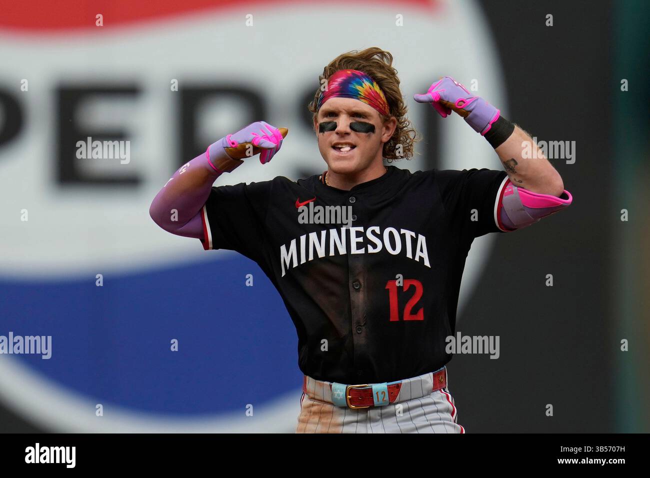 Minnesota Twins' Harrison Bader gestures at second base after hitting a ...