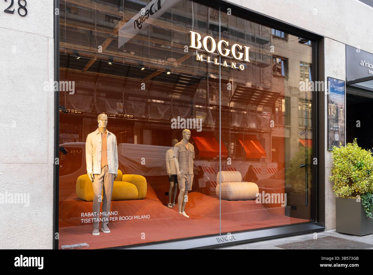 Milan, Italy - April, 08, 2025: Boggi Milano storefront window display ...