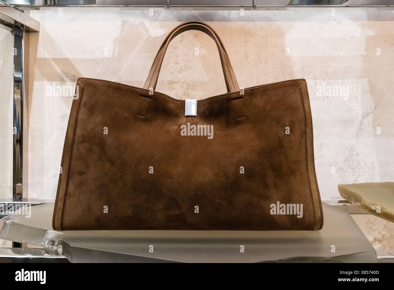 Milan, Italy - April, 08, 2025: Brown suede Phoebe Philo leather tote ...