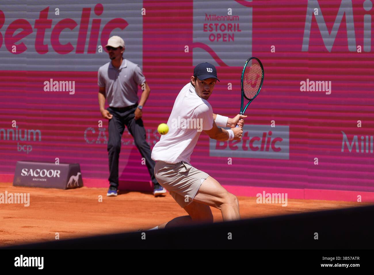 Nicolas Jarry (C) plays against Gastao Elias (not visible) during the ...