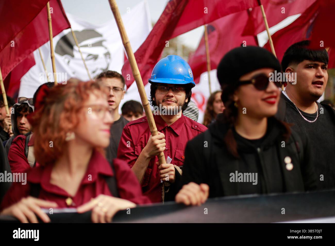 Santiago, Chile. 01st May, 2025. A young communist activist during the ...