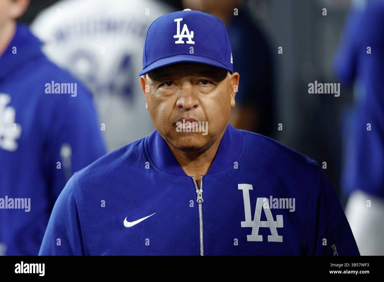 Manager Dave Roberts #30 of the Los Angeles Dodgers walks through the ...