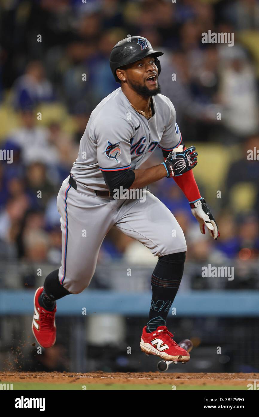 Otto Lopez #6 of the Miami Marlins runs toward first base on a single ...