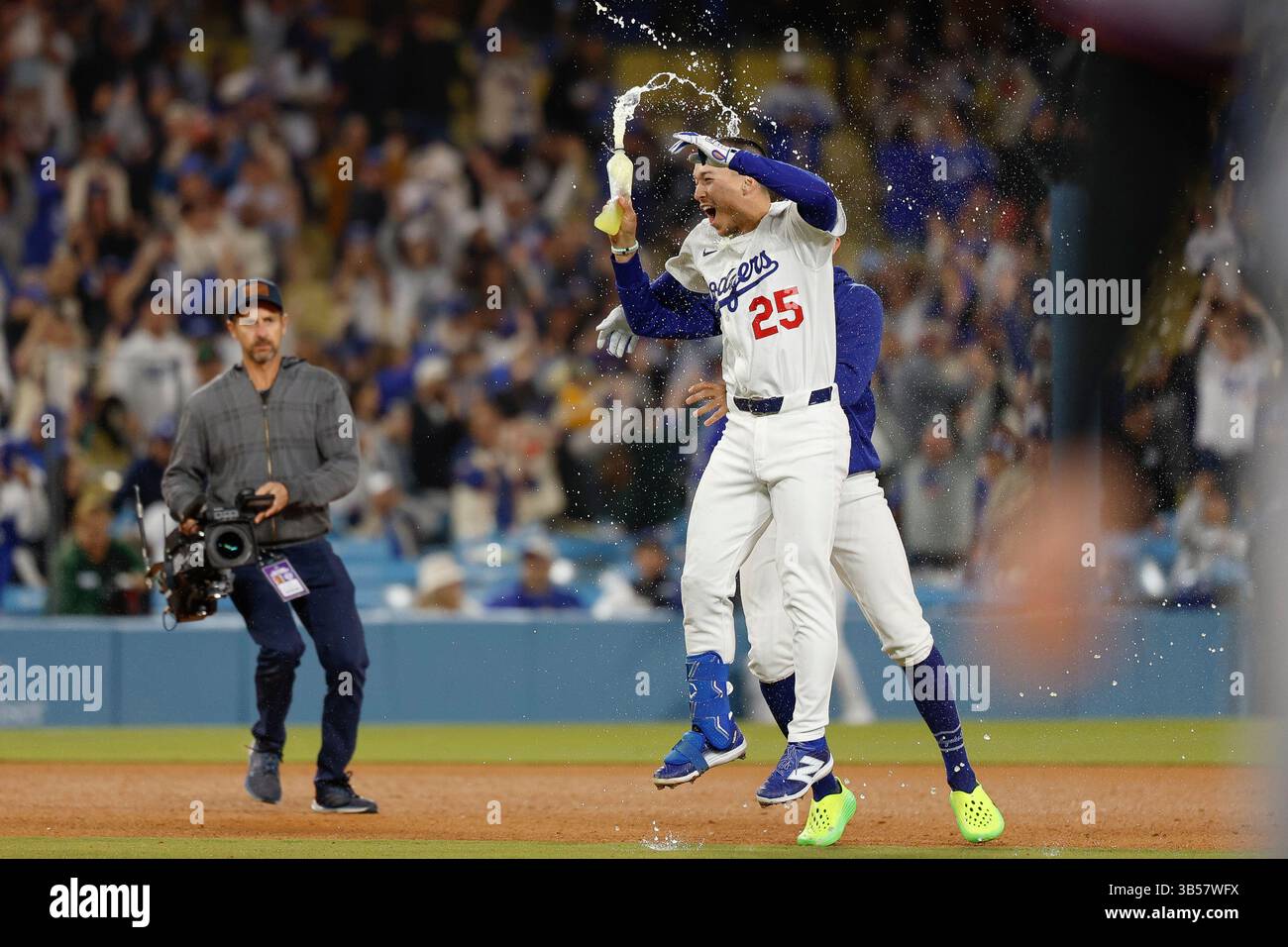 Tommy Edman #25 of the Los Angeles Dodgers celebrates his walk-off ...