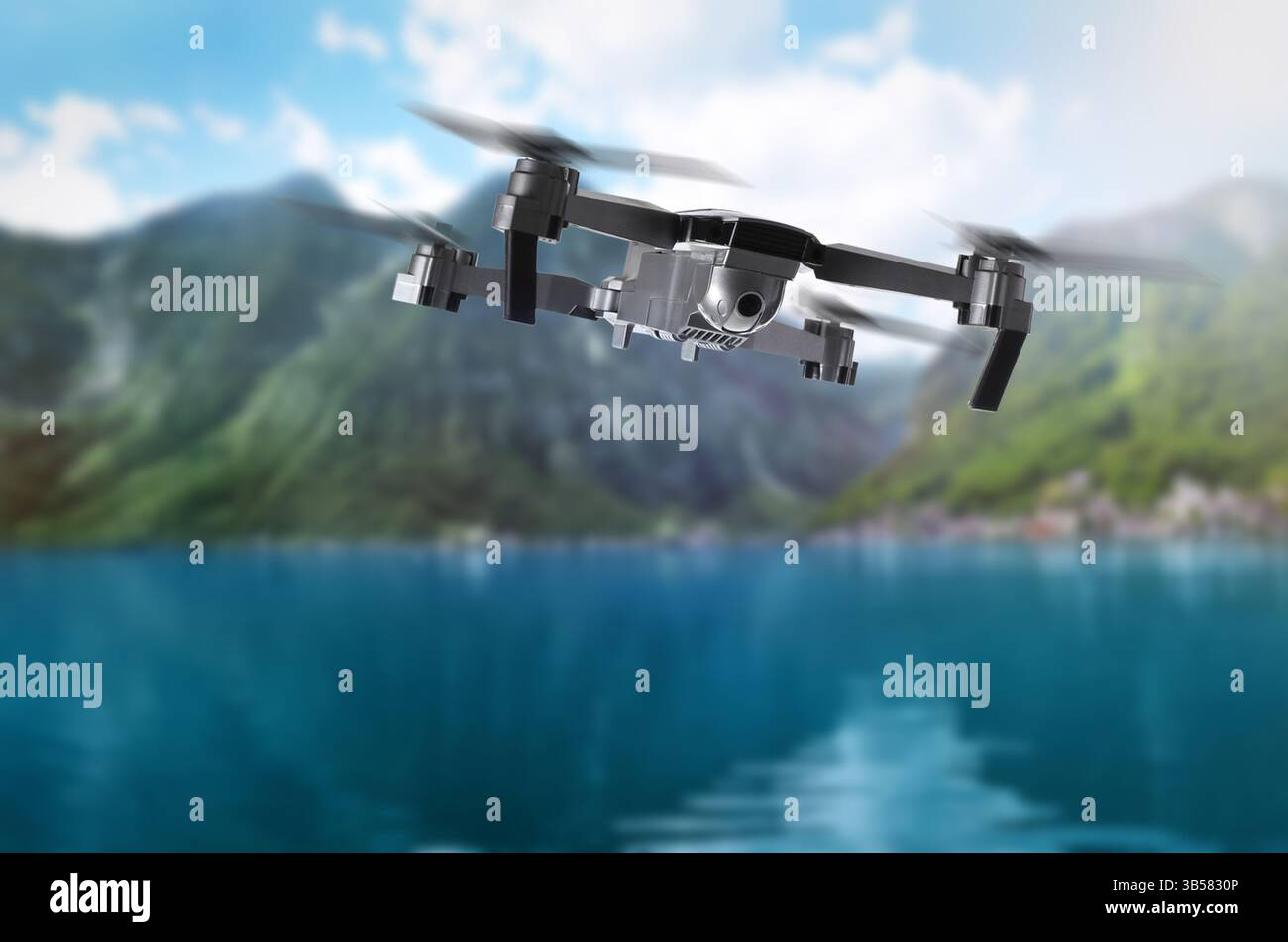 Drone with camera flying over sea. Unmanned aerial vehicle for ...