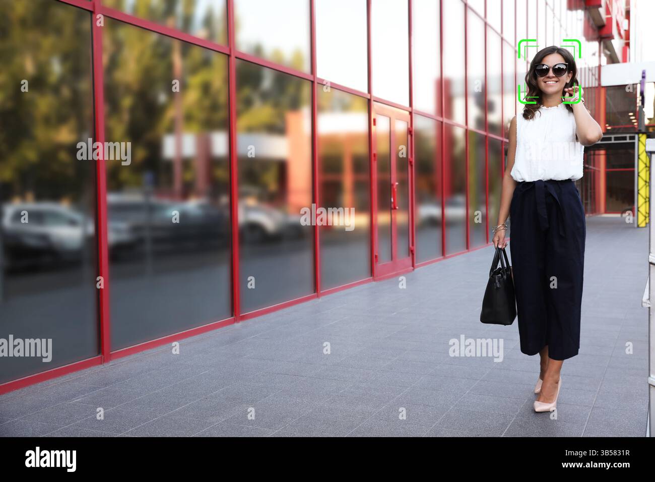 Facial recognition system identifying woman on city street Stock Photo ...