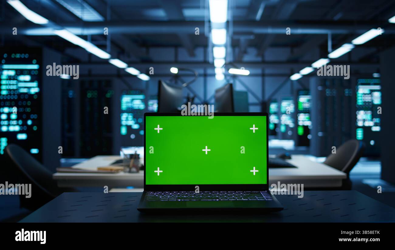 Focus on isolated screen laptop used by engineers in high tech data center to monitor security ...