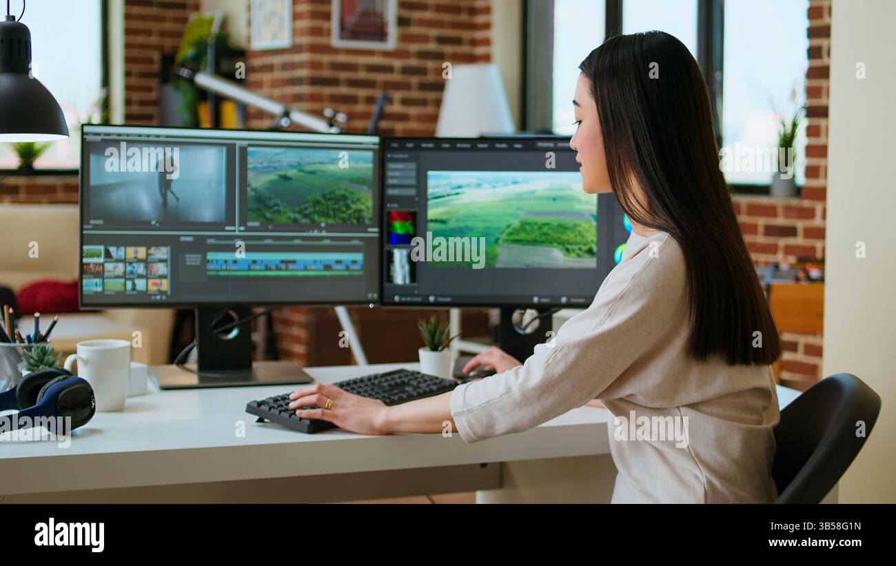 Female filmmaker working on post production from home office, editing timelines and color ...