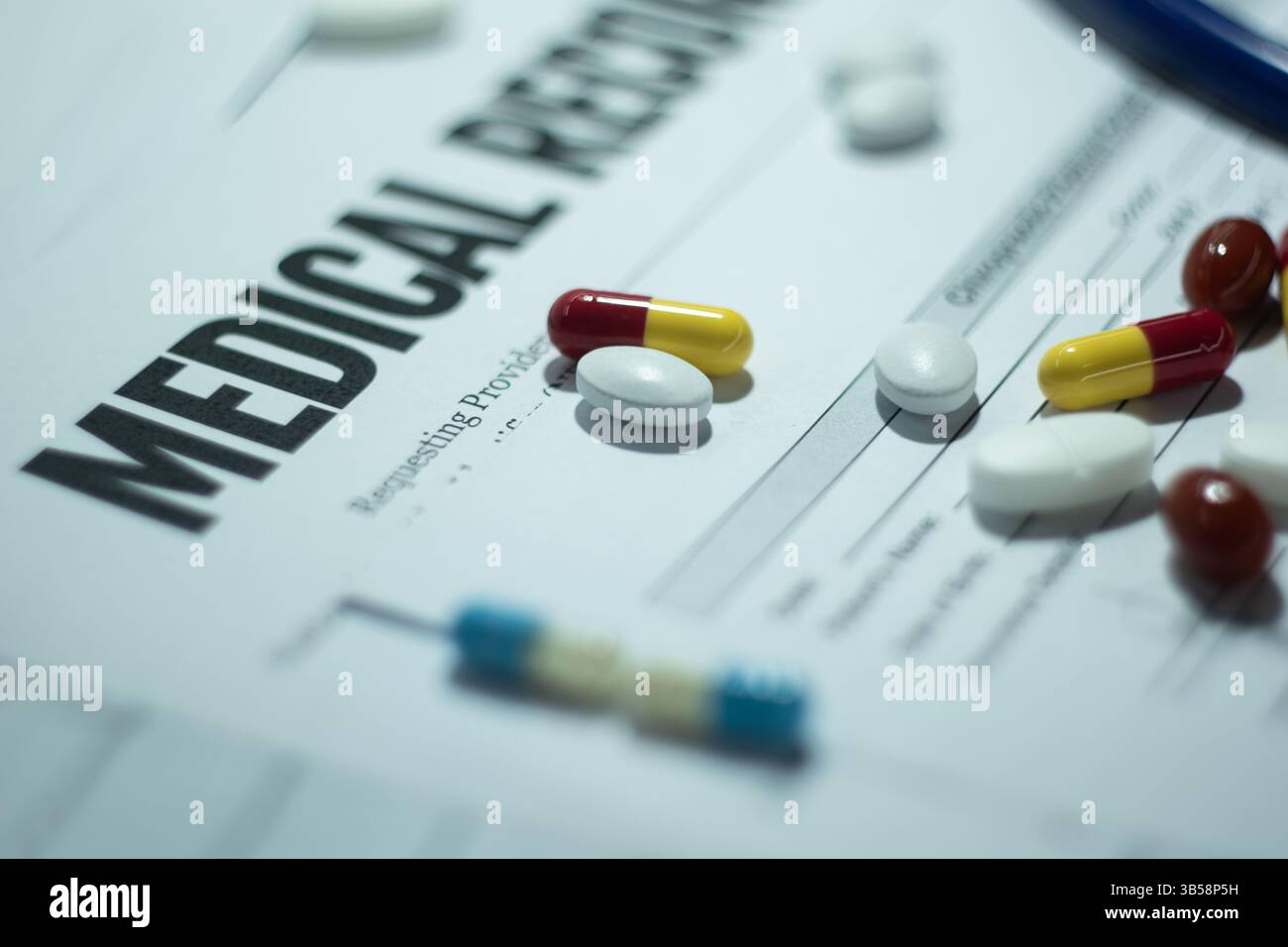 medical records of patients, with pills, and stethoscope, close-up ...