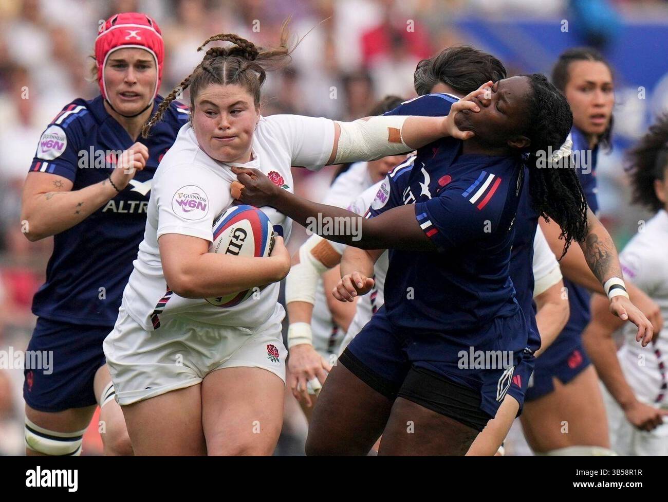 England's Maud Muir, center left, is challenged by Yllana Brosseau, of ...